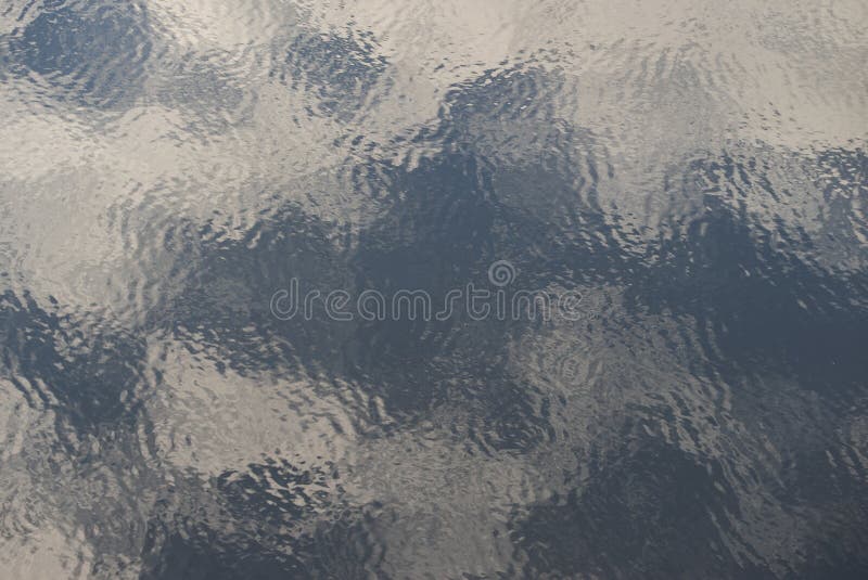 Rippling Water Surface. Reflection of Clouds in the Water Stock Image ...