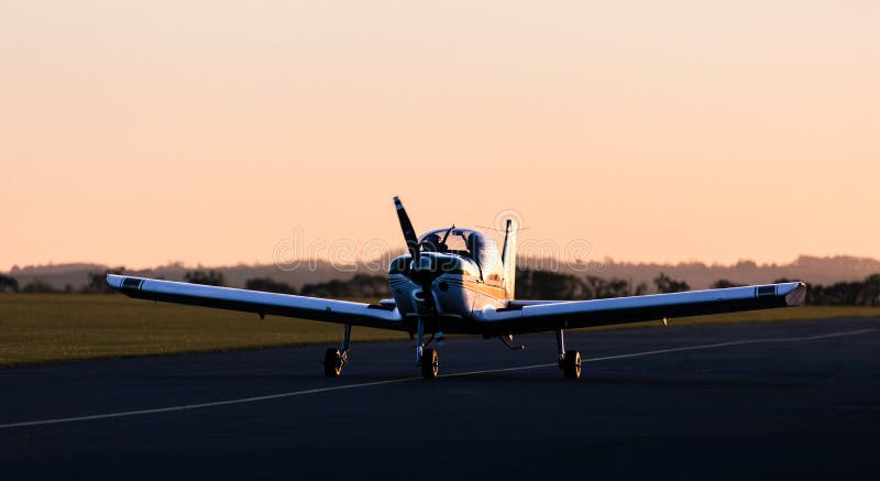 Airplane Rising Ground Front Sunset Stock Photo - Image of sunset ...