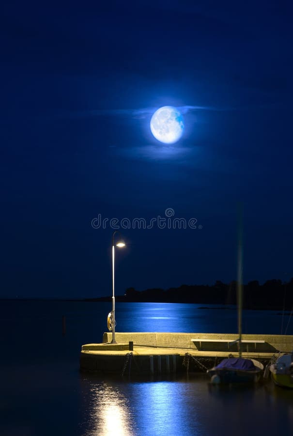 Rising moon on sea stock image. Image of silver, beam - 17826187