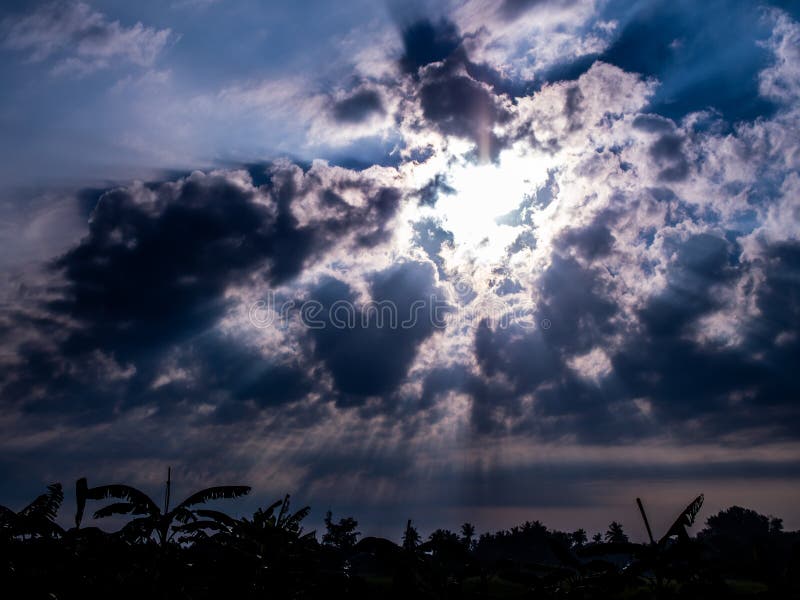 Rising Sun Behind the Beam of Light Stock Photo - Image of delicate ...