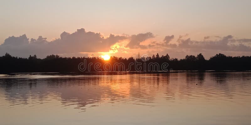 The Rising Sun Illuminate the Morning on the River Bank Stock Image ...