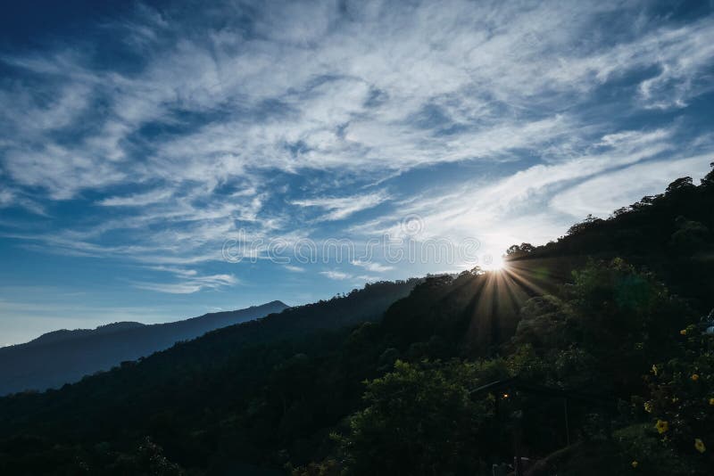 The Rising of the Sun Over a Mountain Range Stock Image - Image of ...