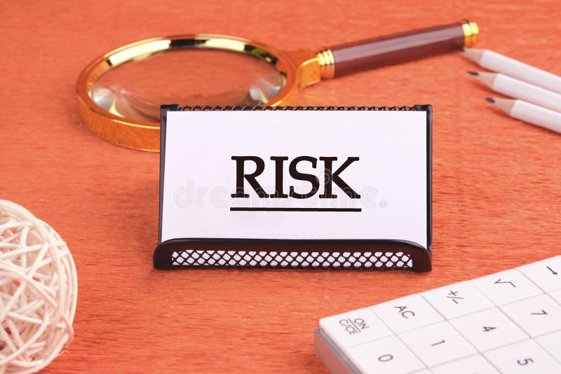 Risk Management Concept. RISK Word Written on a White Card on a Black ...
