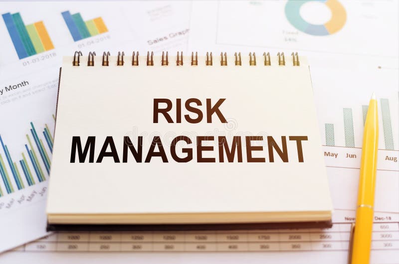 Risk Management Strategies Highlighted in Office Setup with Graphs and ...