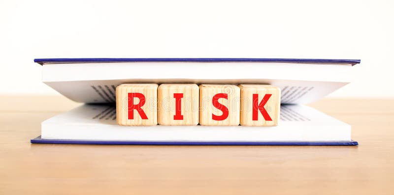 Risk Symbol. Concept Word Risk on Beautiful Wooden Blocks in Book ...