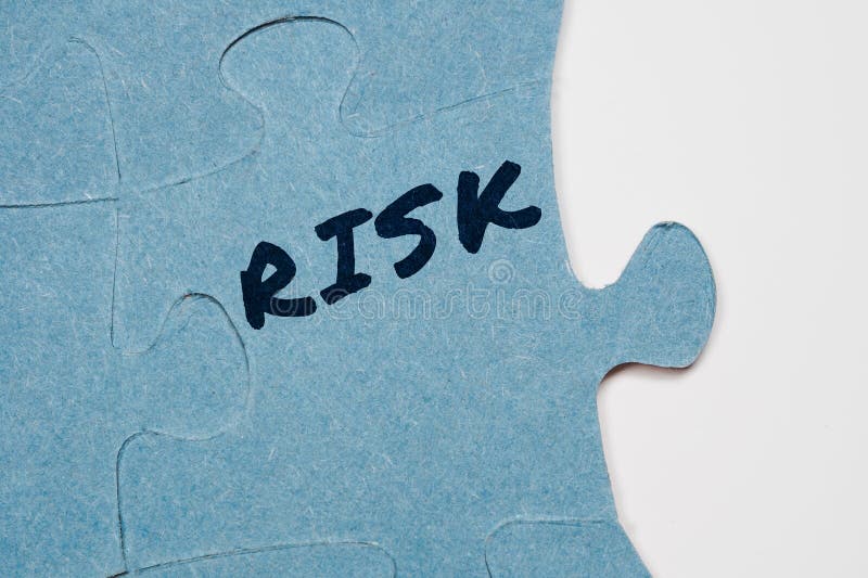 RISK text on puzzle pieces stock image. Image of exposure - 355797951