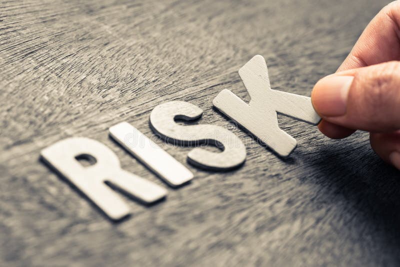 Risk wood letters stock photo. Image of reduce, risk - 103553172