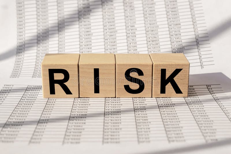 RISK Word Made with Building Blocks on Financial Documents Stock Image ...