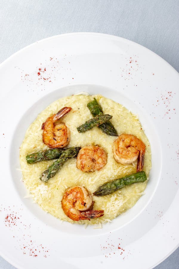 Risotto with Parmesan Cheese, Asparagus and Shrimp Stock Photo - Image ...