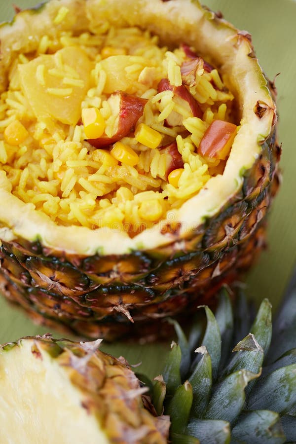 Risotto with Pineapple Pieces and Ham Inside Pineapple Fruit Stock ...