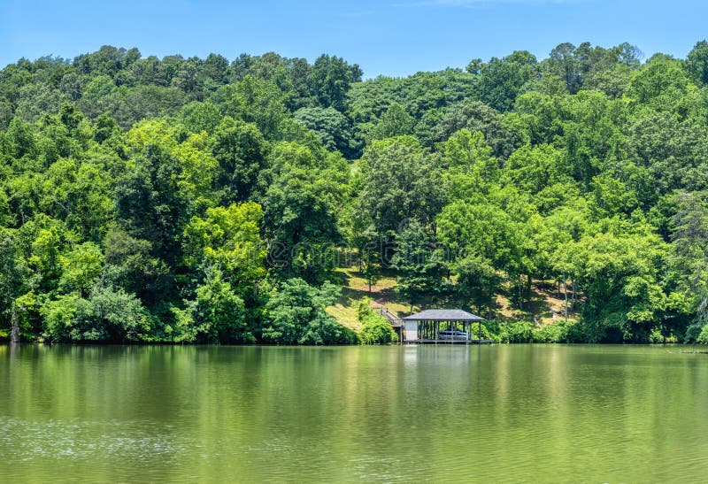 River Background Image with Boathouse at Waters Edge Stock Photo ...