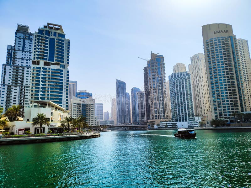 River with Bridge, Boat, Palm Trees on the Left Side Editorial Image ...
