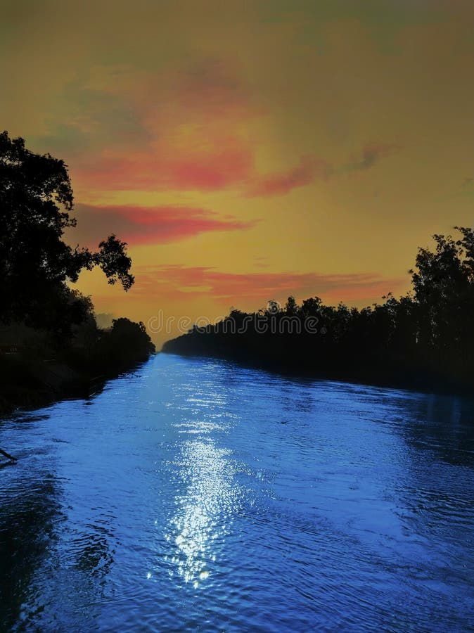 River canal in blue colour stock photo. Image of sunlight - 184814910