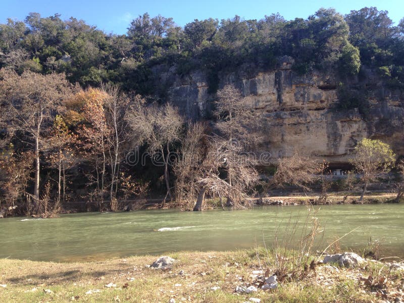 River cliff stock image. Image of rocks, cliff, river - 80295693