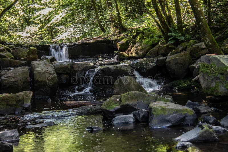 River Course Littered with Rocks with Waterfal Stock Photo - Image of ...