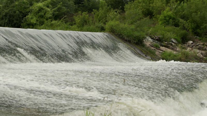 River Dam. the Water Flows Out of the Dam of a Small River. Development ...