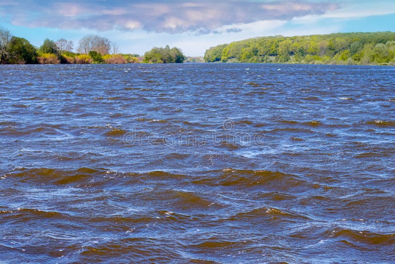 River with Dark Water and Waves during the Wind Stock Photo - Image of ...