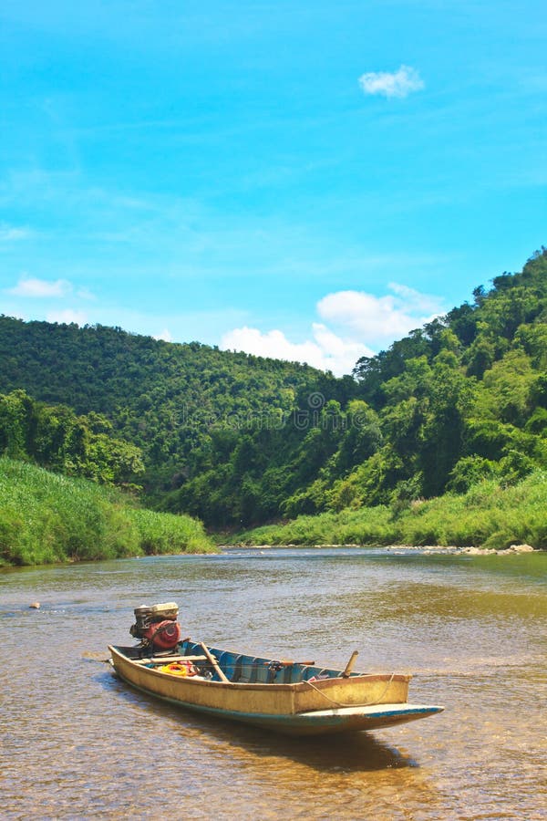 River in Evergreen Forest with Boat Stock Image - Image of rapid ...