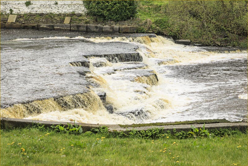 River in Flood Pouring Over a Waterfall Stock Image - Image of pouring ...