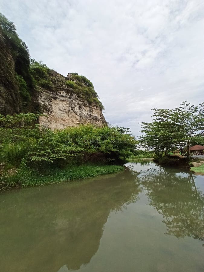 River Flow and Limestone Cliffs in the Photo from a Potrait Angle Stock ...