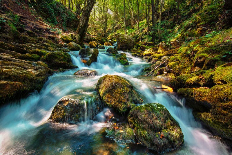 River Flowing on Mossy Boulders Stock Photo - Image of pass, idyllic ...