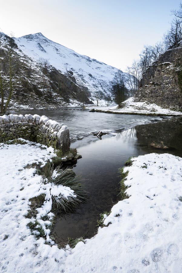 River Flowing through Snow Covered Winter Landscape in Forest Va Stock ...