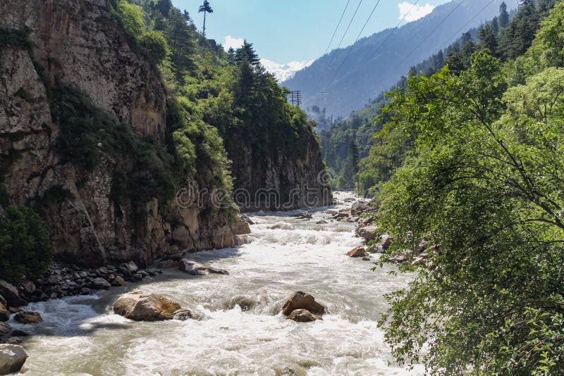 River flowing in te hills stock photo. Image of skies - 95508338