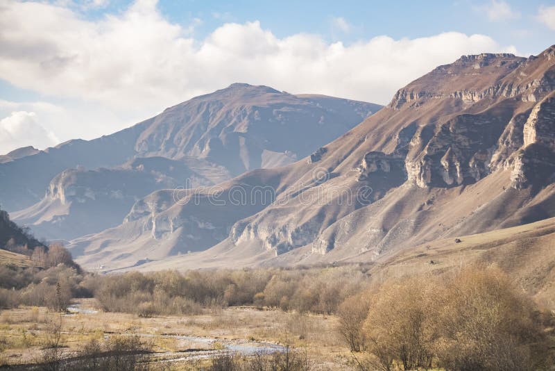 The River Flows in a Mountain Valley between the Ridges in Autumn ...