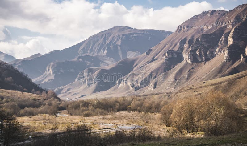 The River Flows in a Mountain Valley between the Ridges in Autumn ...