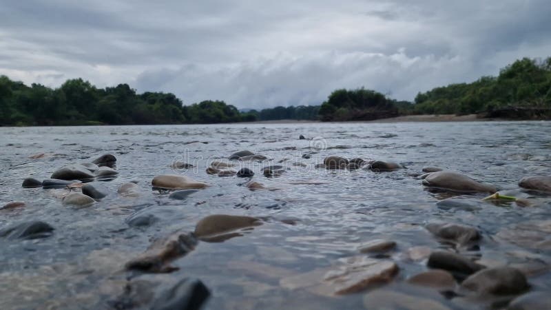 A River Flows Over Rocks in this Beautiful Scene in the Forest. Stock ...
