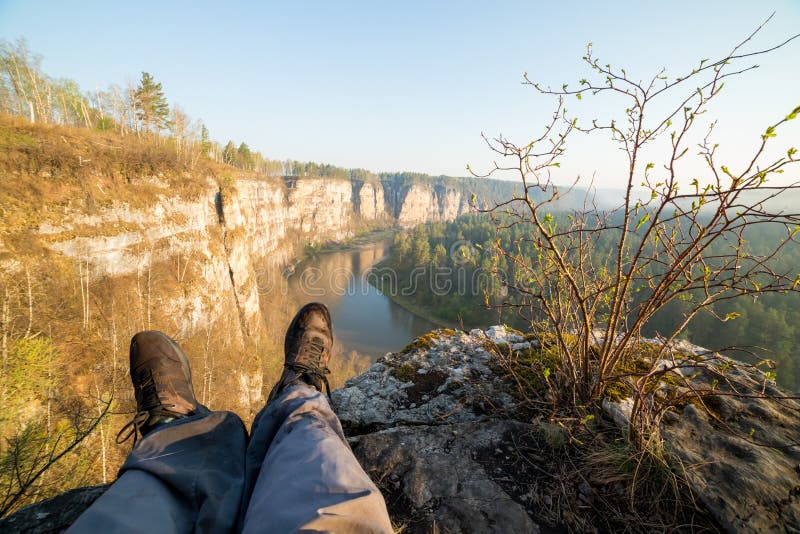 River in the Forest and Cliffs Edge. a Man Sitting on the Edge Stock ...