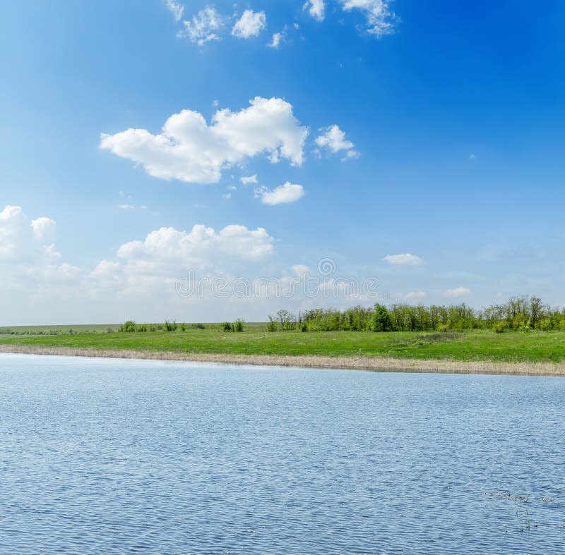 River and Green Grass and Blue Sky with Clouds Stock Image - Image of ...
