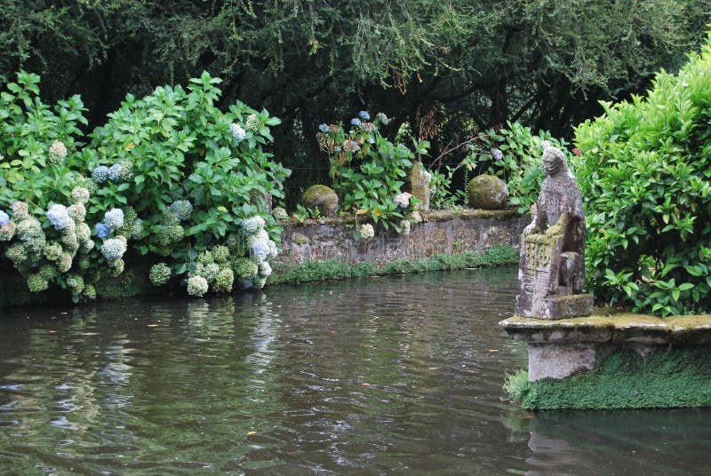 River with Greenery Around, and Small Sculpture on the Side in Pazo De ...