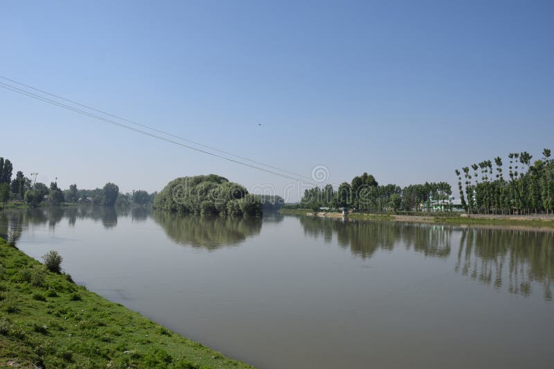River Jehlum with Island of Willow Trees Stock Photo - Image of river ...