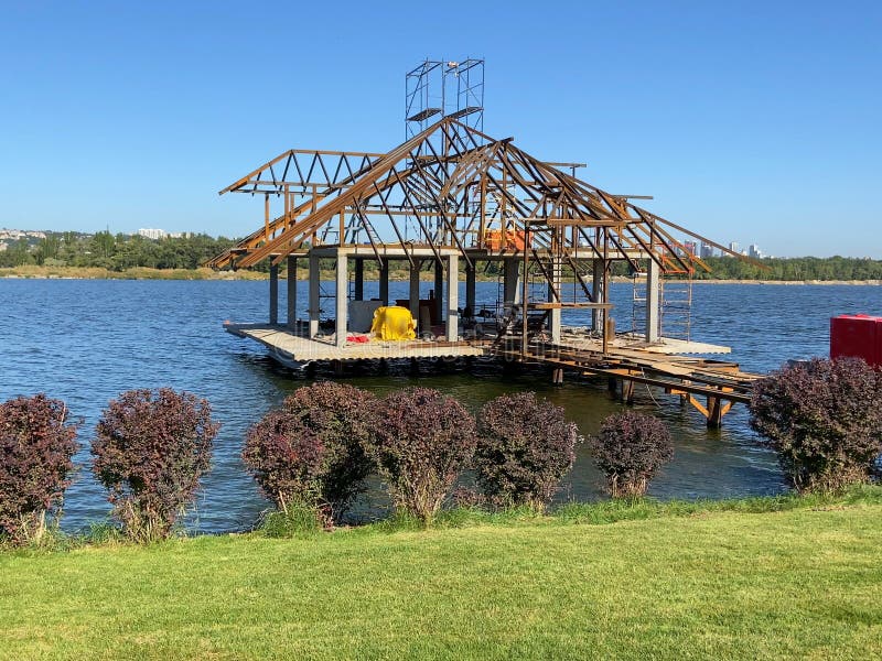 River or Lake House Building, Home on the Water Construction in Summer ...