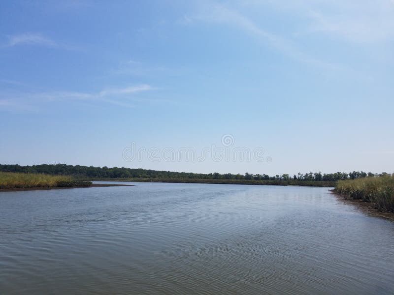 River or Lake Water and Blue Sky and Grass Stock Photo - Image of calm ...