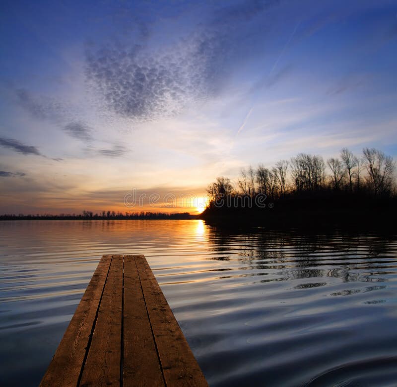 River Landscape with Pier and Sunset on River Stock Photo - Image of ...