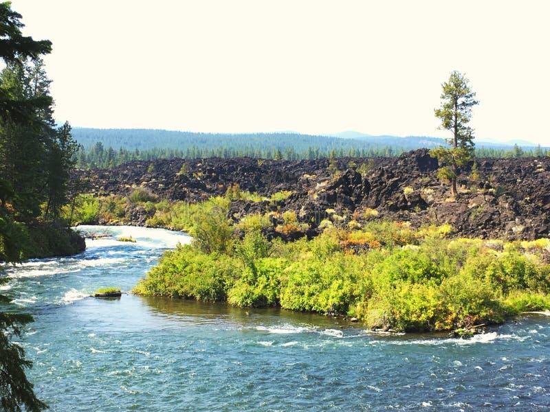 River and Lava Rock stock photo. Image of deschutes - 100093428