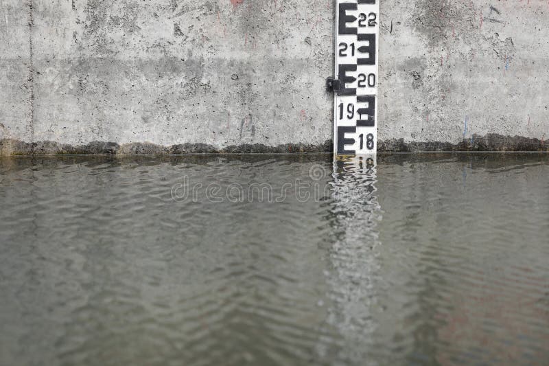 River Level Marker Near a Sluice on a Concrete Man Made River Stock ...