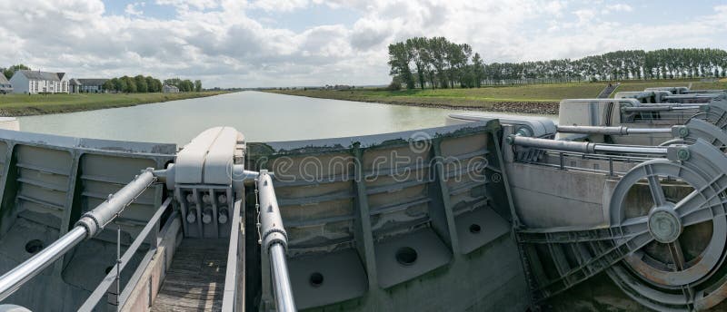 River Locks and Weir To Regulate Water Flow in Canal System Stock Photo ...