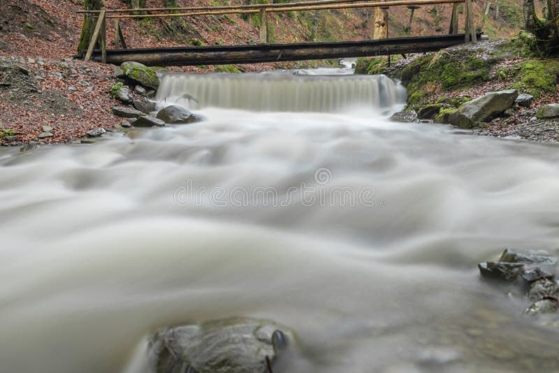 River Long Exposure with Surrounding Forest and Rocks Stock Photo ...