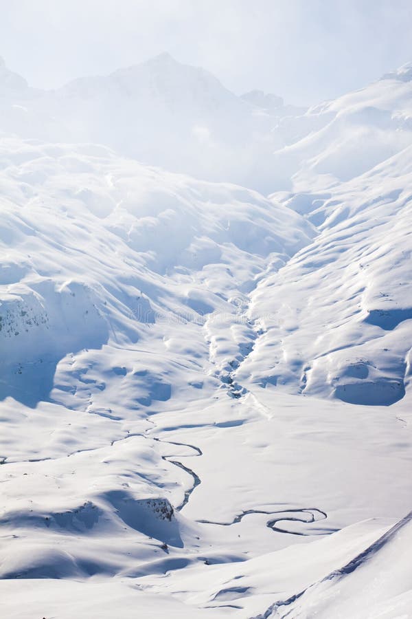 River in the Middle of a Valley Full of Snow Stock Photo - Image of ...