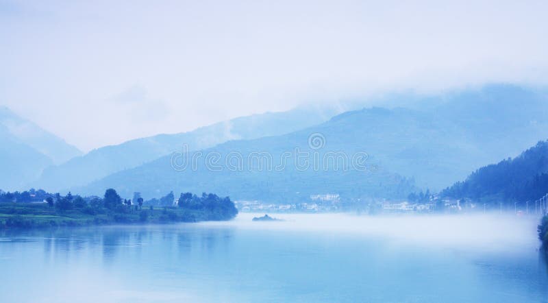 River in mist stock photo. Image of buildings, mountains - 25923490
