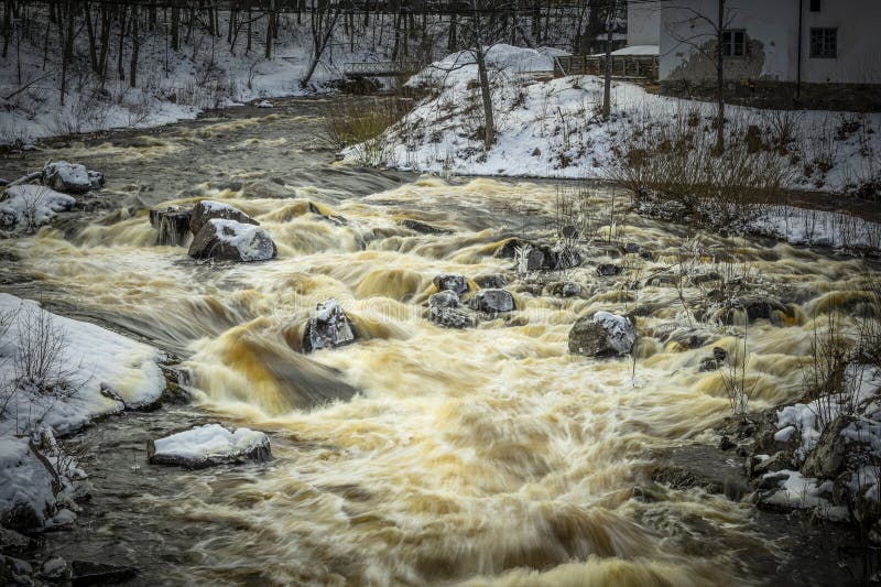 River with Muddy Water Flowing Over Rocks Stock Image - Image of ...