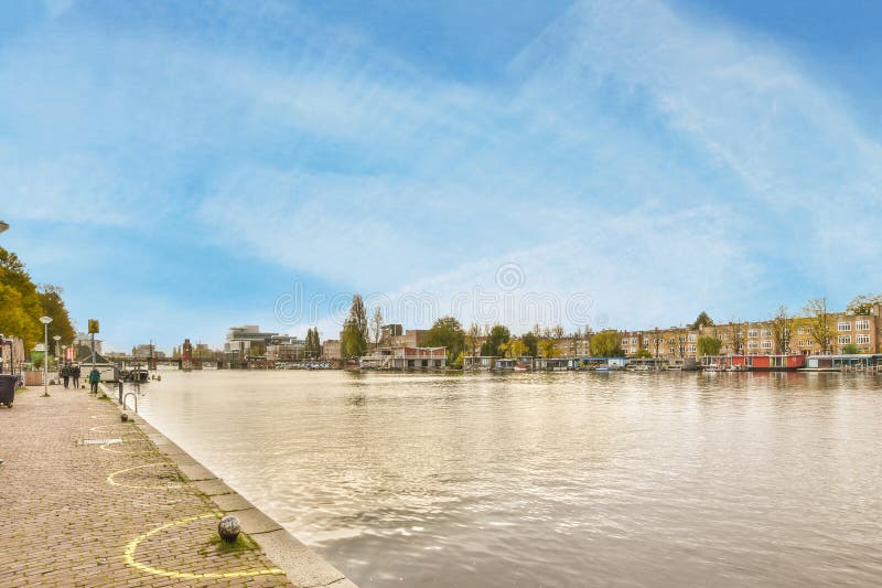 A View of a River with Buildings in the Background Editorial Image ...