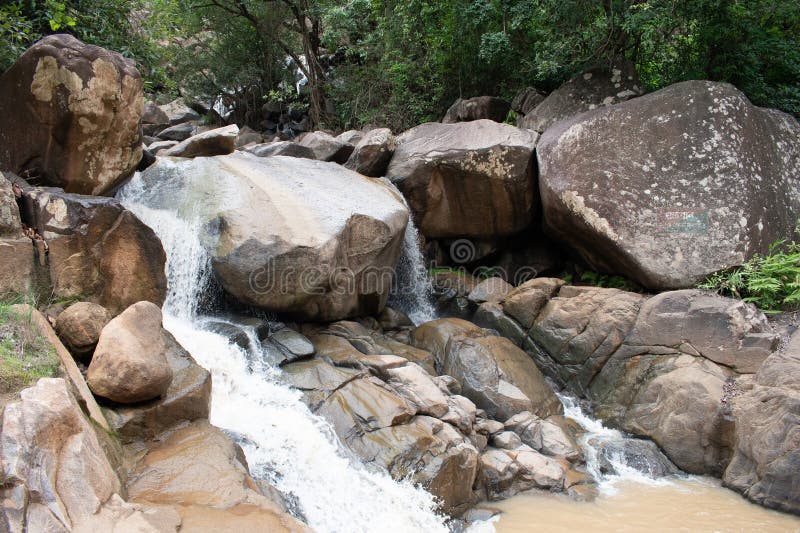 River Rapids through Large Boulders in the Forest Stock Image - Image ...