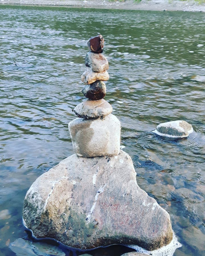 Rock Balancing On Ocean Beach, Stones Stacking By Sea Water Waves ...