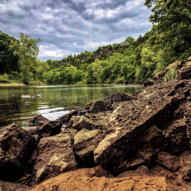 River rock bed stock photo. Image of water, trees, clouds - 159464264