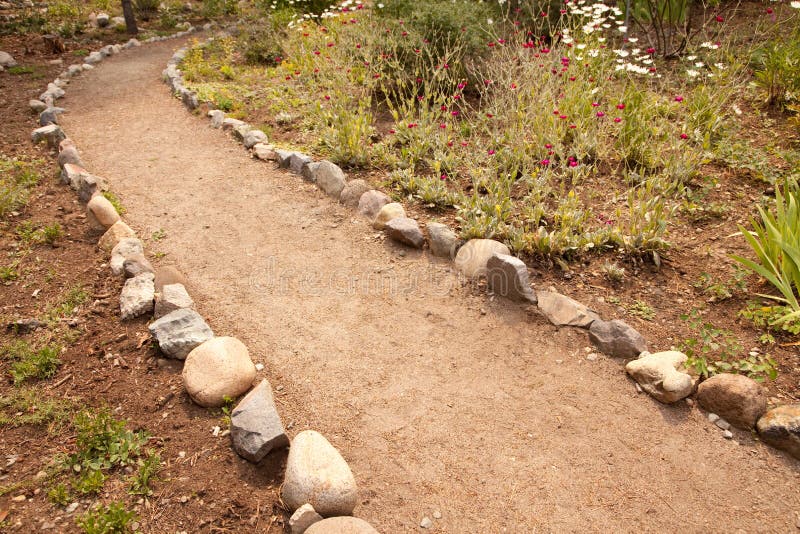 River Rock Lined Dirt Garden Path Stock Photo - Image: 10749340