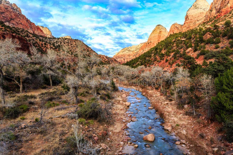 A River Runs through a Valley with Trees on Either Side Stock Photo ...